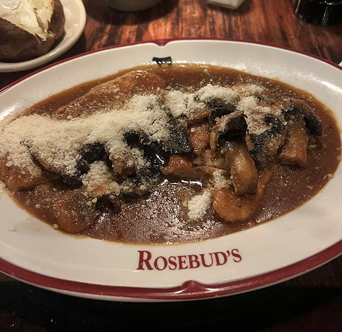 The Chicken Marsala arrives like a savory lullaby&mdash;mushrooms and wine sauce creating a harmony that makes conversation pause mid-sentence.