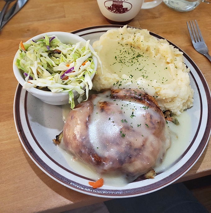 The Chicken Pot Pie arrives like comfort food royalty&mdash;tender chicken beneath a golden crown of pastry with creamy gravy that could solve most of life's problems.