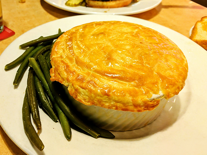 Golden, flaky crust hiding savory treasures beneath &ndash; this chicken pot pie isn't just comfort food, it's a warm hug for your taste buds.