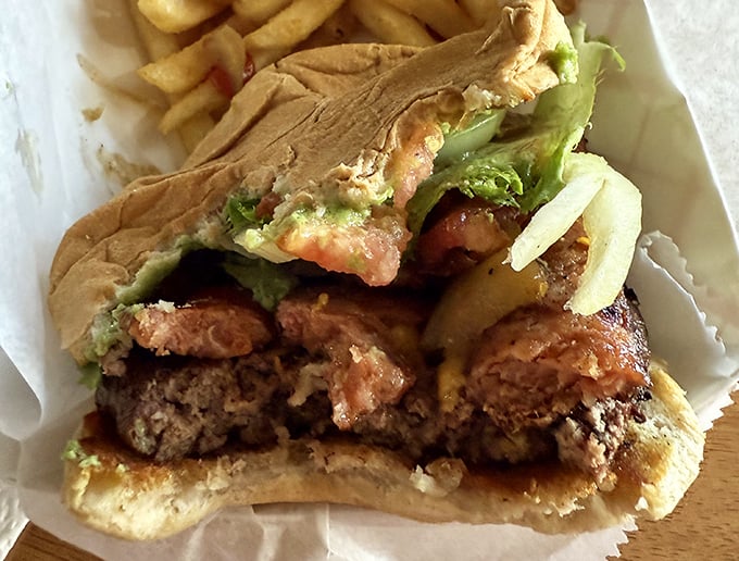 Cut into this burger and witness the perfect cross-section&mdash;charred exterior, juicy interior, and toppings in harmonious balance.