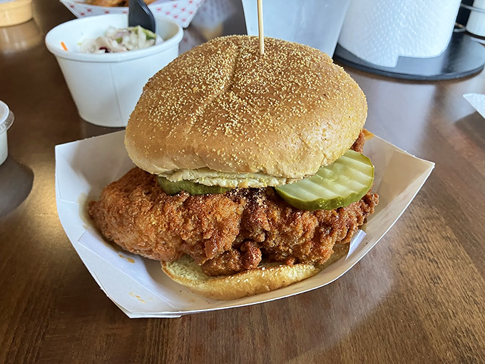 The chicken sandwich that launched a thousand road trips, with pickles standing guard like tart, green sentinels.