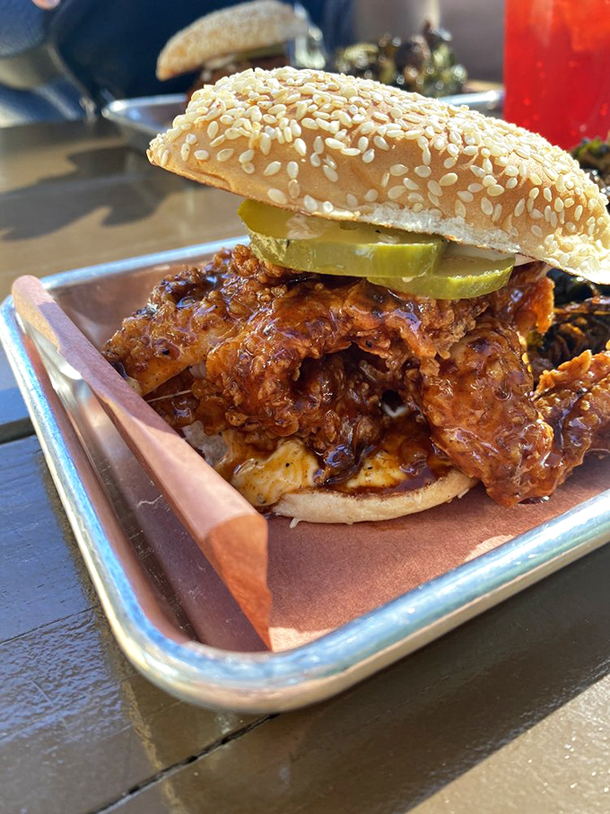 A sandwich that requires both hands and a strategy. The pickles add that perfect acidic counterpoint to the sweet, smoky meat.