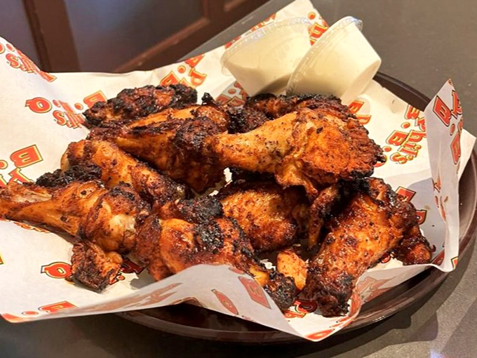 Chicken wings that flew too close to perfection. Crispy-skinned, smoke-kissed, and seasoned with what must be some kind of addictive magic dust.