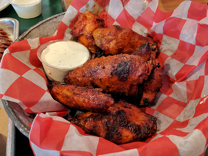 These wings have gone through more transformations than a superhero movie—smoked, fried, and grilled to crispy, spicy perfection.