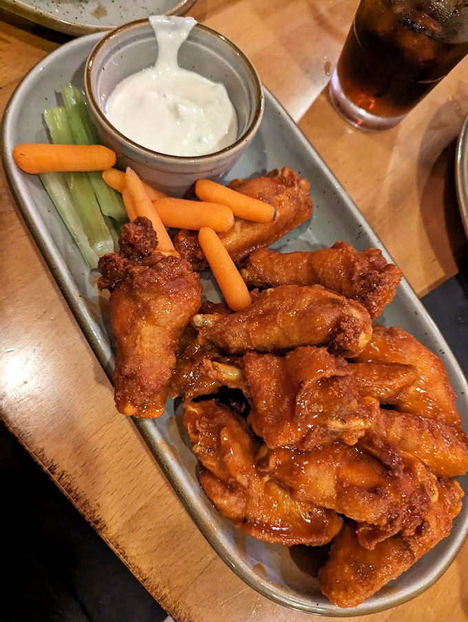 These wings aren't just fried—they're transformed. Tallow-fried to golden perfection with a crunch that announces itself three tables away.