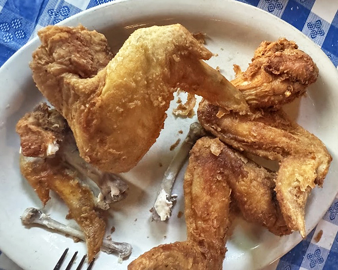 Pan-fried chicken so perfectly golden it belongs in Fort Knox. The crunch you hear when biting in might be the sound of happiness. 