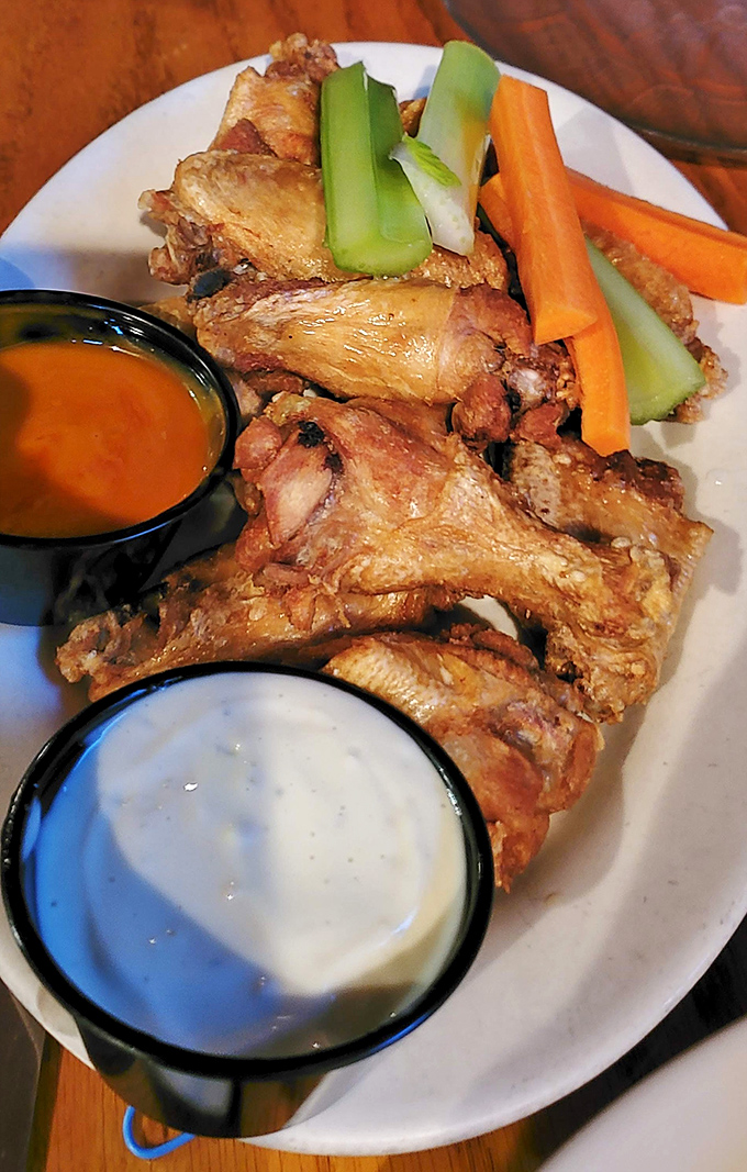 These wings aren't just wings&mdash;they're a masterclass in crispiness, served with the kind of dipping sauces that make you contemplate drinking them straight.