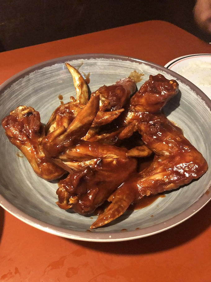 Wings that don't just fly&mdash;they soar. Glistening with sauce that's probably worth bottling and selling as liquid gold.