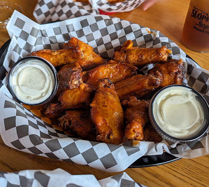 Wings that make you question why you ever bothered with utensils. Two dipping sauces because life's too short for monogamy when it comes to condiments.