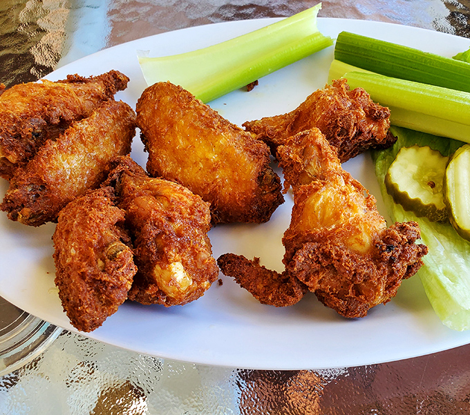 Crispy chicken wings that don't need a sporting event as an excuse to be ordered. The celery sticks are just there for appearances.