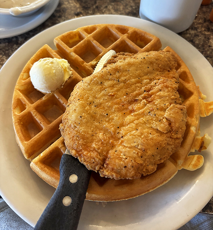 Golden waffle meets perfectly fried chicken&mdash;a combination that proves breakfast and lunch should never be forced to choose sides.
