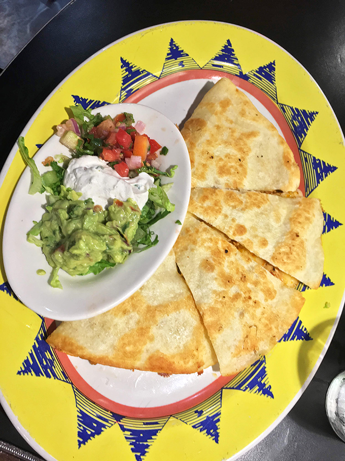 Golden-brown quesadillas with the perfect cheese pull, served alongside guacamole so fresh it might have been an avocado just moments ago.