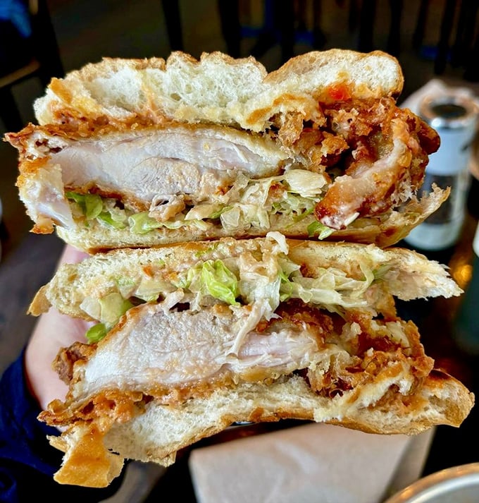 Layer upon layer of crispy chicken, fresh lettuce, and secret sauce create a sandwich architecture so perfect it deserves its own blueprint. 