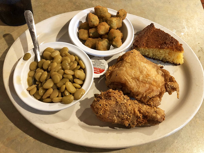 Southern comfort on a plate: golden fried chicken, lima beans, and cornbread. The holy trinity of soul-satisfying diner food done right.