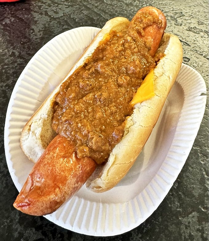 This glorious mess of chili, cheese, and frankfurter proves that some indulgences are worth every messy bite.
