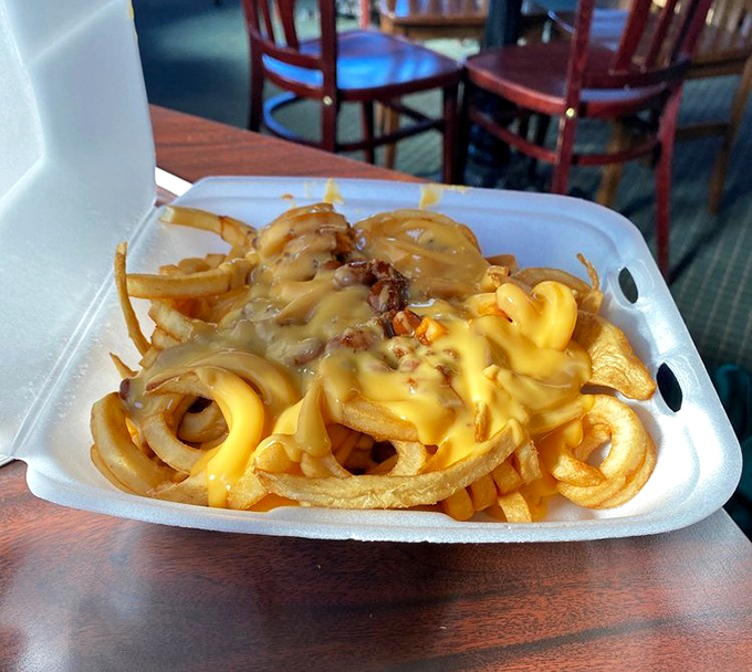 Chili cheese fries piled high enough to require structural engineering and definitely more napkins than you think.