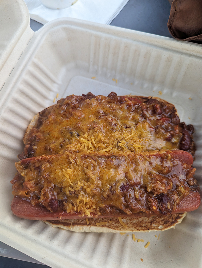 This isn't just any chili dog&mdash;it's a masterpiece of melted cheese and savory chili that demands both napkins and your undivided attention.