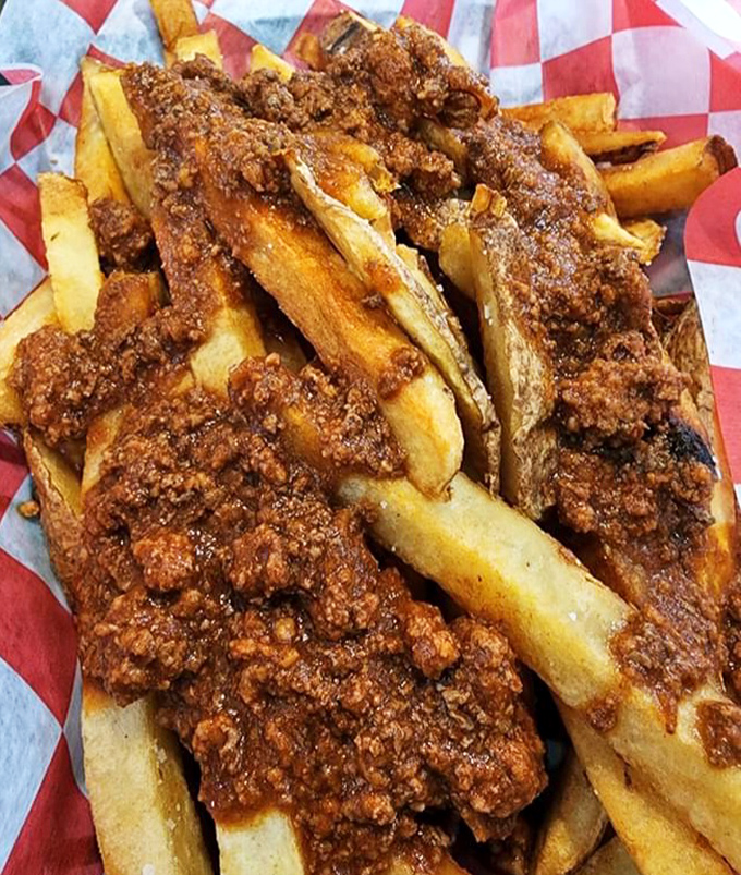 These chili fries aren't just a side dish; they're a main event worthy of their own parade, with each fry standing tall beneath its meaty crown.