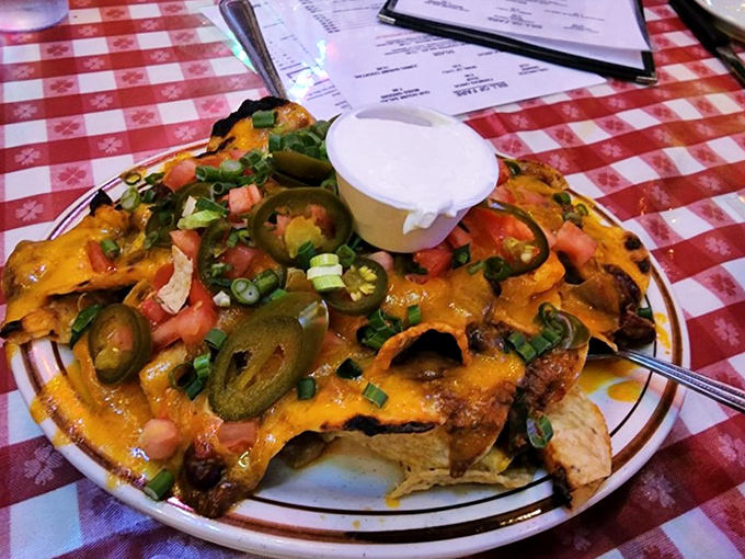 These nachos aren't messing around &ndash; loaded with chili, jalape&ntilde;os, and enough cheese to make Wisconsin nervous. Sharing optional but not recommended.