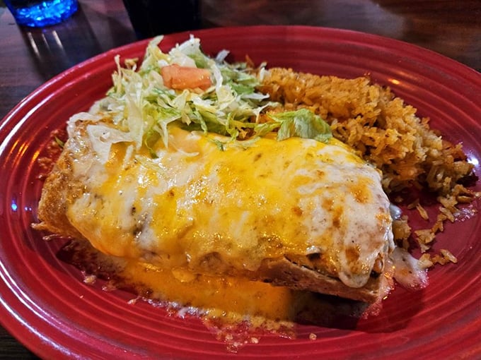 This chimichanga isn't just fried, it's transformed—like Clark Kent entering a phone booth and emerging as Superman with cheese on top.