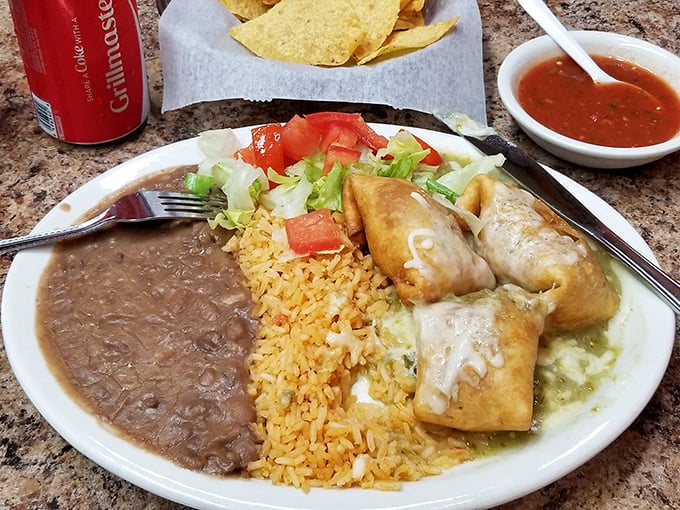 The chimichanga &ndash; that magical moment when a burrito takes a spa day in hot oil. Crispy exterior, tender filling, and that green sauce is practically drinkable.