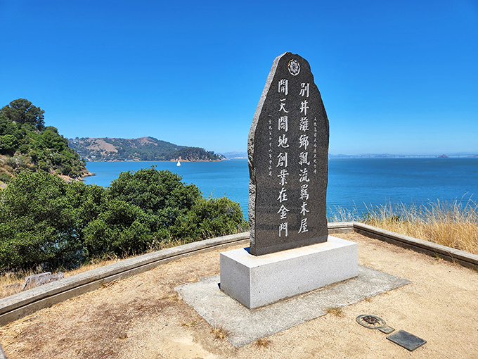 This stone monument honors the thousands of Chinese immigrants who passed through Angel Island, their stories etched in memory like the characters on this weathered stone.