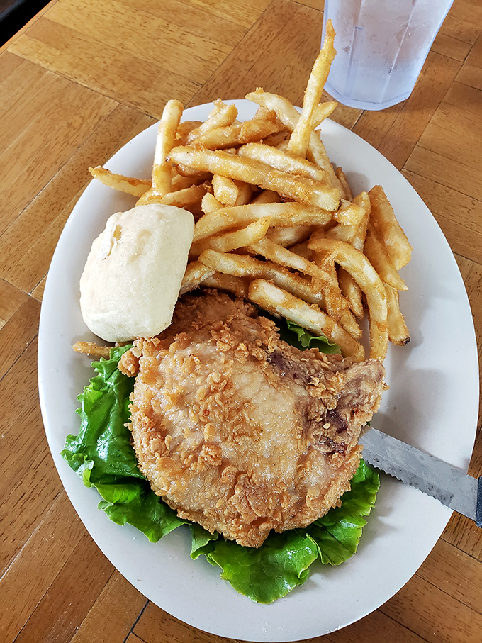 Crispy fries piled high next to a golden-fried masterpiece &ndash; proof that sometimes the simplest meals deliver the most profound satisfaction.