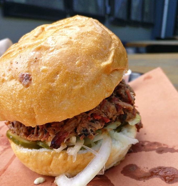 A sandwich that requires both hands and a strategy. This brisket-stuffed beauty demands respect—and plenty of napkins.