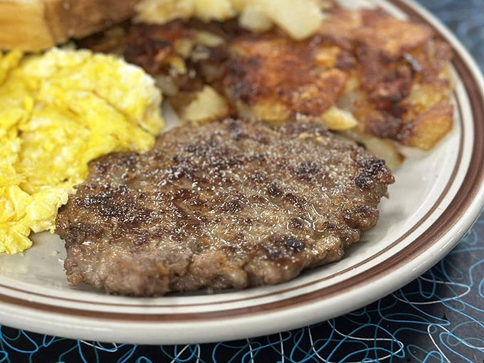 A breakfast plate that doesn't just feed you—it hugs you from the inside out. That sausage patty has clearly found its forever home.