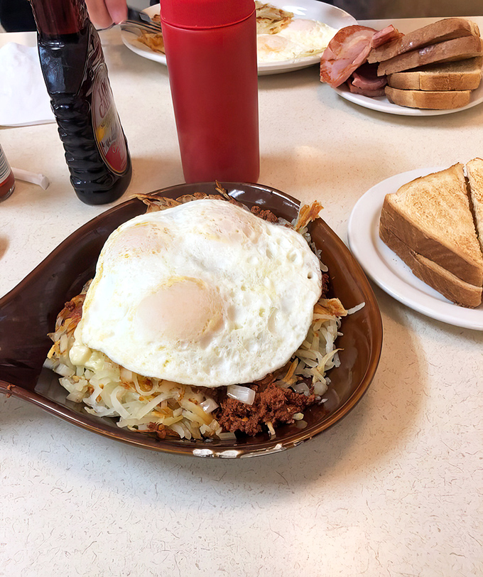 Breakfast skillet heaven: crispy hash browns, savory chorizo, and that perfectly fried egg on top. Morning fuel that'll keep you smiling until dinner.