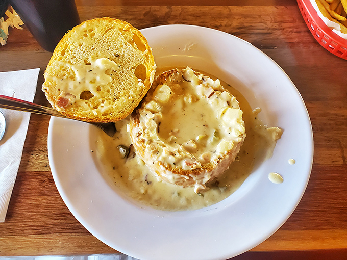 The ultimate bread bowl experience&mdash;a sourdough fortress filled with creamy clam chowder that turns eating soup into an architectural demolition project.