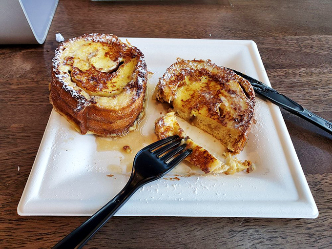 Breakfast of champions or dessert of geniuses? This cinnamon roll's gooey center reveals itself like the final plot twist in a delicious mystery.