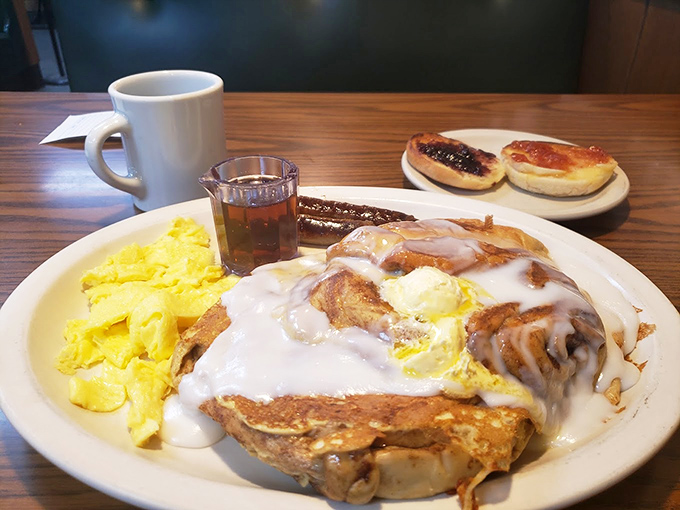 This cinnamon roll with its crown of whipped cream isn't just breakfast—it's dessert with an alibi and permission to eat it before noon.