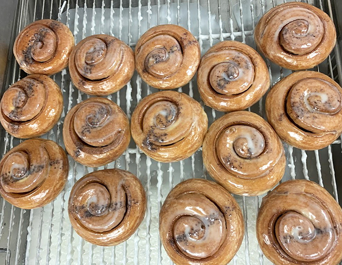 Cinnamon rolls spiraling into infinity, glazed like they've been kissed by sugar angels themselves.