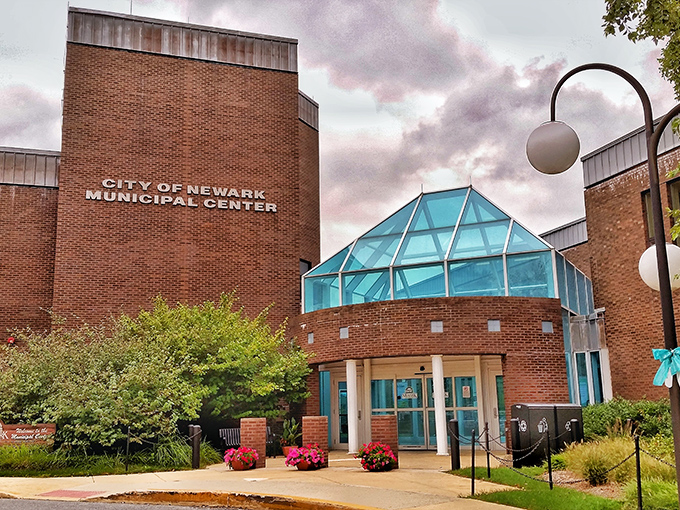 Newark's Municipal Center stands proudly with its distinctive glass atrium. Even government buildings have architectural personality in this college town.