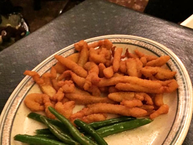 Golden-fried perfection with a side of vibrant green beans&mdash;comfort food that speaks the universal language of "you're going to need a nap after this."