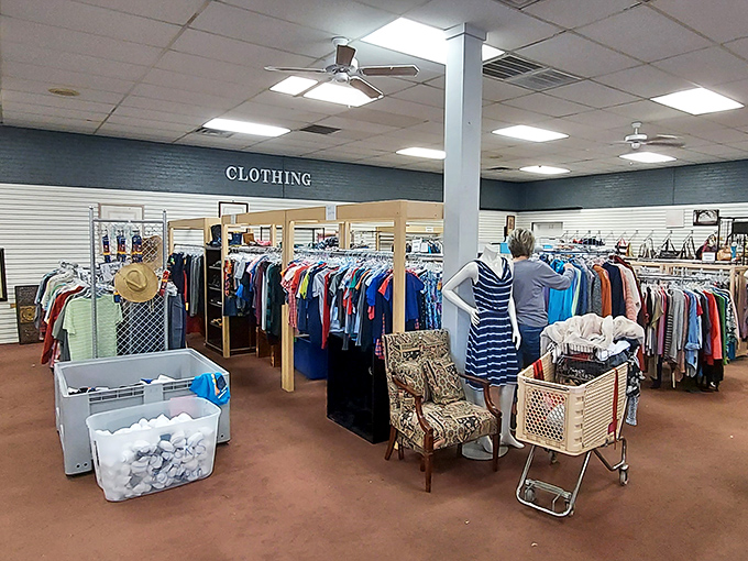 The clothing section: where "retail therapy" meets "budget-friendly." Shoppers browse racks organized by size, not chaos&mdash;a thrift store miracle.