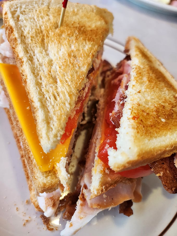 The club sandwich stands tall and proud, layers stacked with military precision&mdash;a skyscraper of comfort between perfectly toasted bread.
