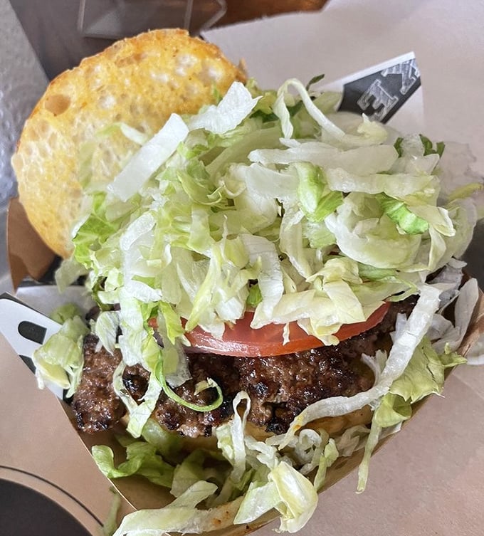 The Cockeye Burger doesn't need fancy toppings to impress&mdash;just fresh lettuce, tomato, and enough meat to remind you why humans developed incisors in the first place.