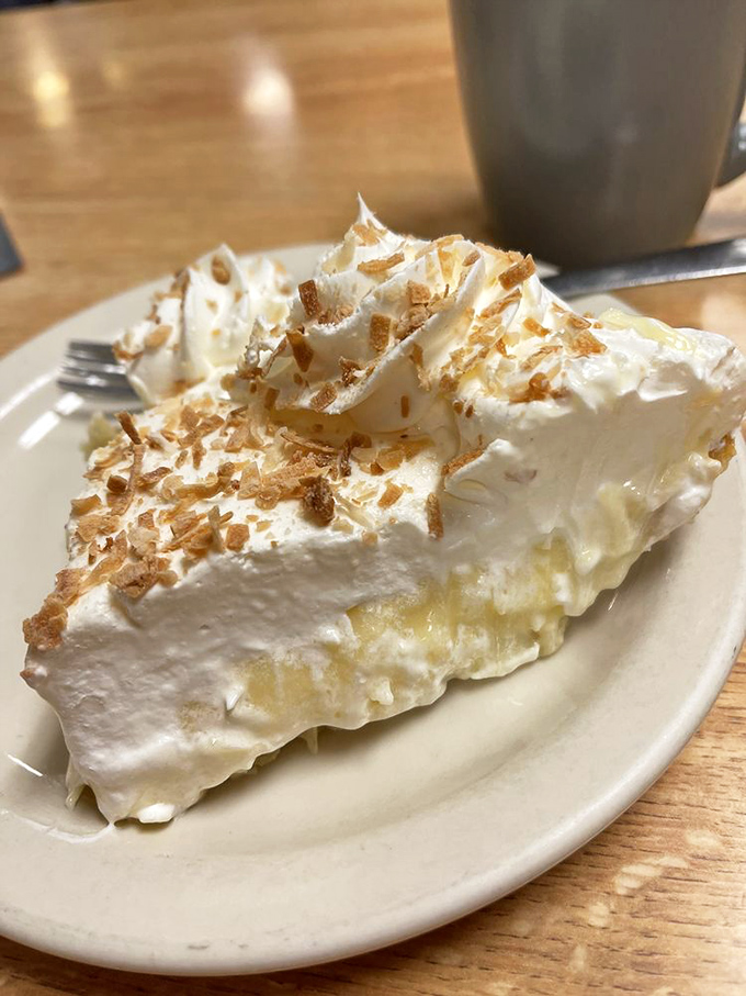Coconut cream pie with toasted coconut flakes&mdash;architectural in height, cloud-like in texture. Resistance is futile.