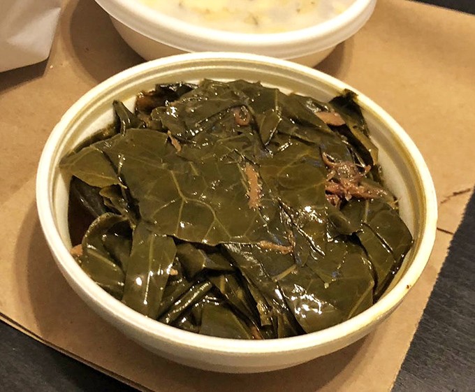Collard greens swimming in potlikker that contains more flavor than some entire restaurant menus. Southern comfort in every forkful.