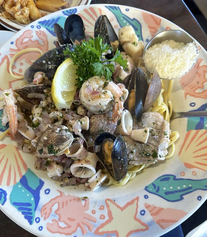 A pasta dish that would make Neptune himself put down his trident and pick up a fork. The ocean's finest treasures, perfectly arranged on a colorful plate.