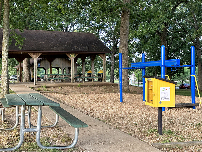 Cooper Park's pavilion waits patiently for family reunions and community gatherings, where potato salad recipes are secretly compared.