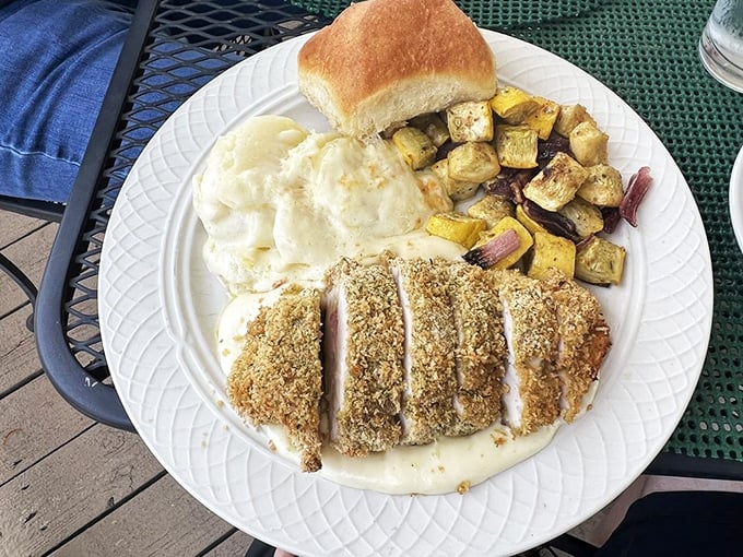 Breaded perfection meets creamy indulgence in this chicken dish. The roasted potatoes and mashed potatoes create a delightful double-carb experience no one asked for but everyone needs.