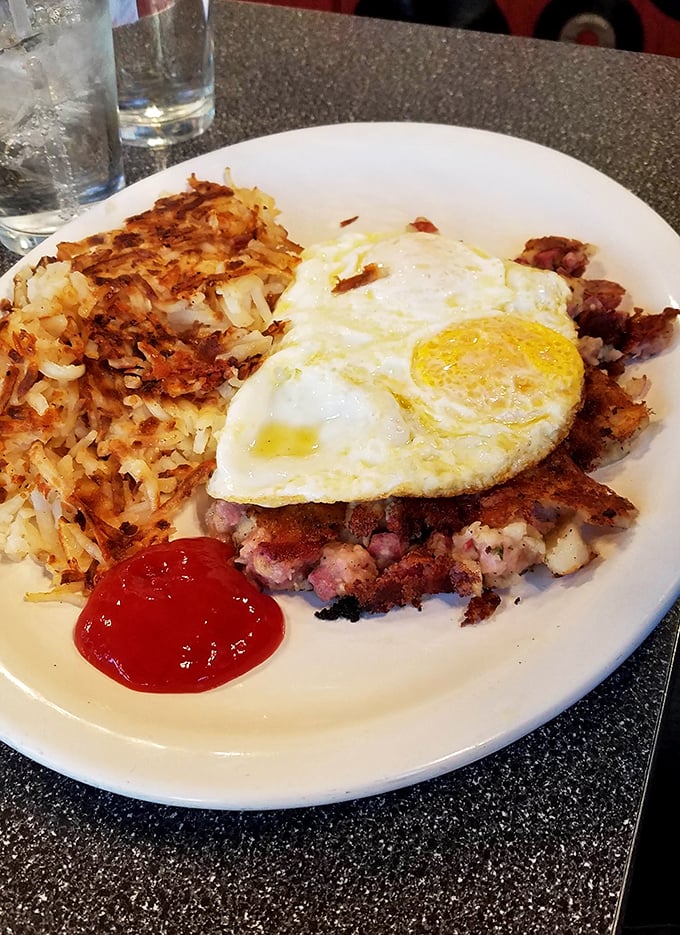 Corned beef hash that wasn't born in a can, topped with an egg whose yolk is about to create the world's most delicious sauce.