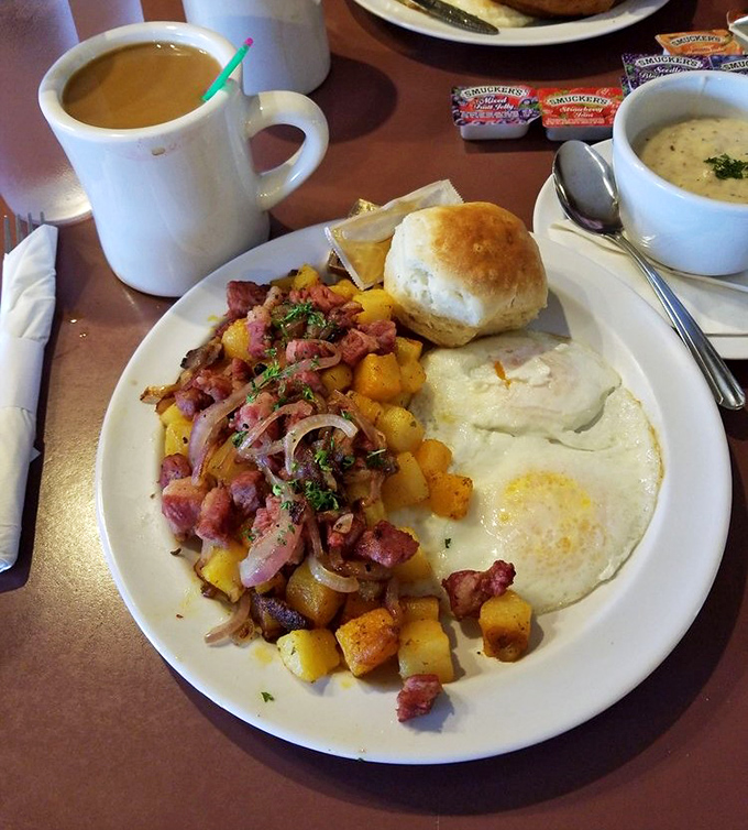 A hearty breakfast plate featuring seasoned potatoes mingling with ham and eggs&mdash;the kind of fuel that powers Pacific Northwesterners through rainy mornings.