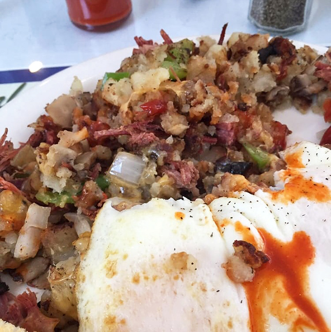 The famous Park Potatoes with corned beef hash and eggs&mdash;a mountain of breakfast glory that makes you understand why people willingly wait in line on weekend mornings.