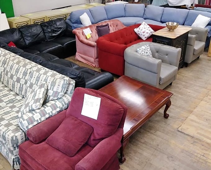 This furniture showroom offers couches in every color imaginable, from bold pink to sensible burgundy, all seeking new living rooms.