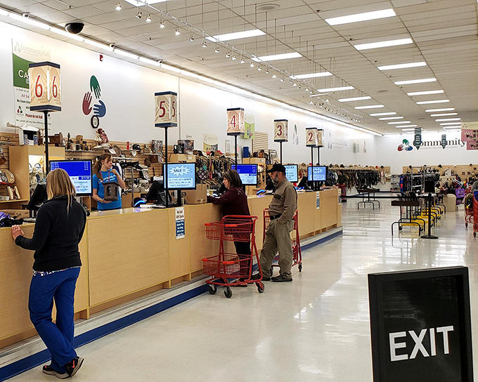 The checkout area buzzes with activity—the final stage of the thrifting journey where $29 can fill an entire cart with newfound treasures.