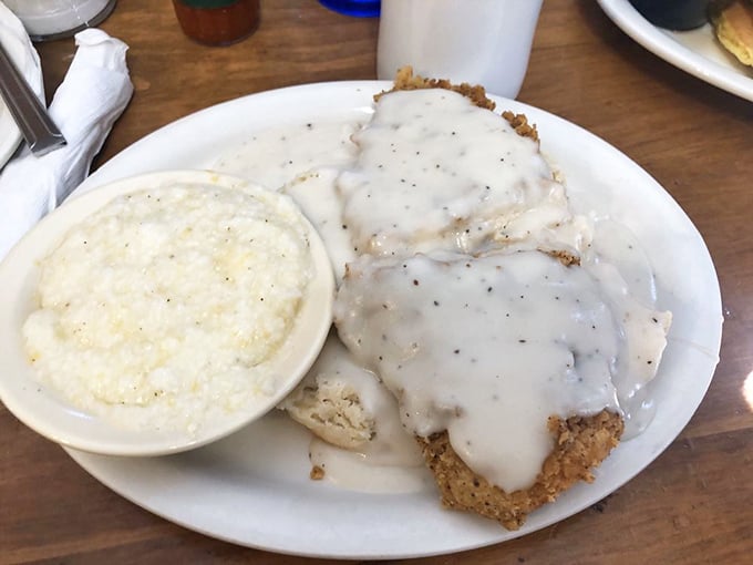 Country fried steak smothered in gravy that's practically a southern baptism. The side of grits completes this religious experience.